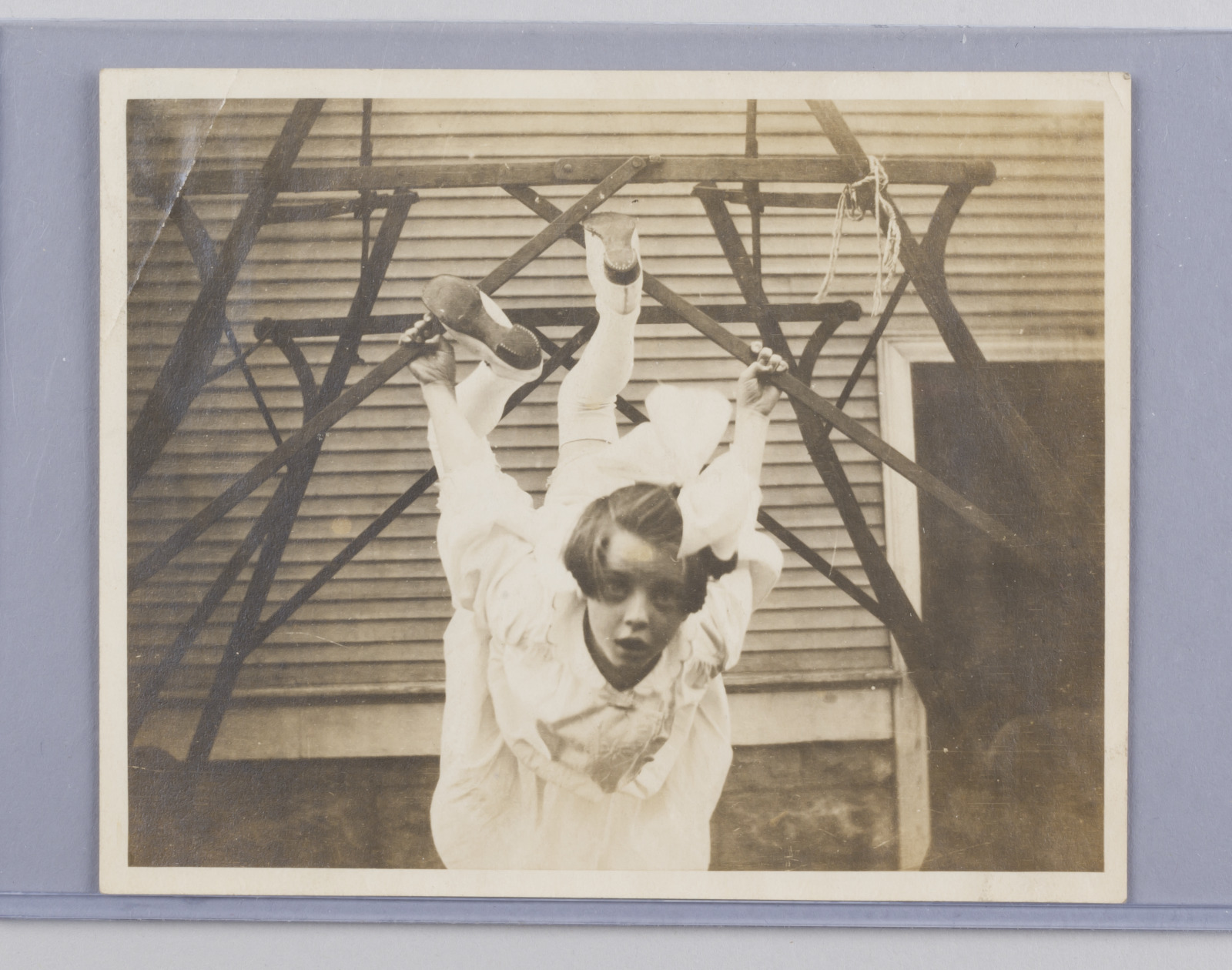 Untitled (Girl with Large Bow in Hair Hanging from Junglegym) - Saint ...