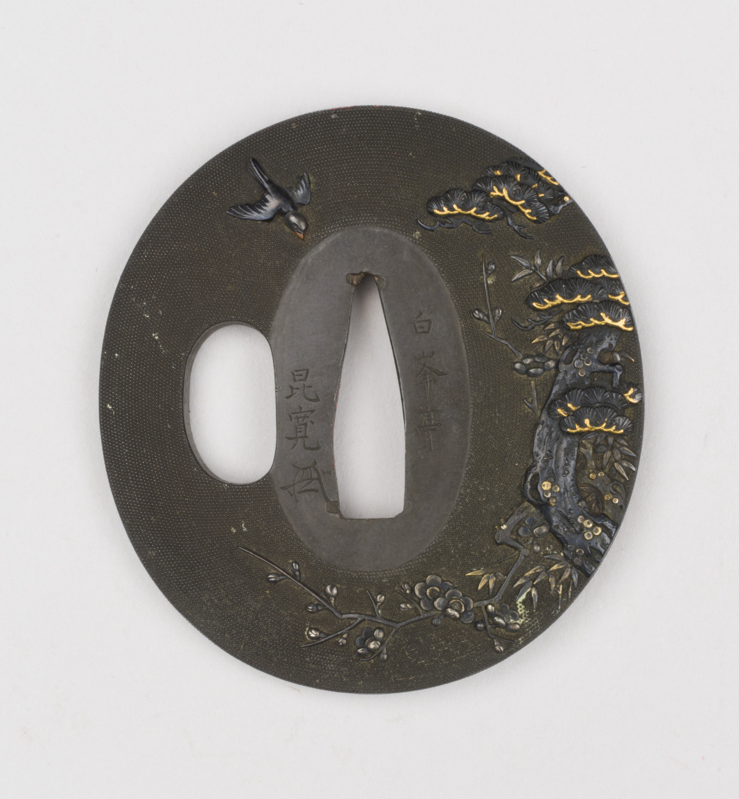 Sword Guard (tsuba) with Design of Pine, Bamboo, Prunus, and Swallow ...